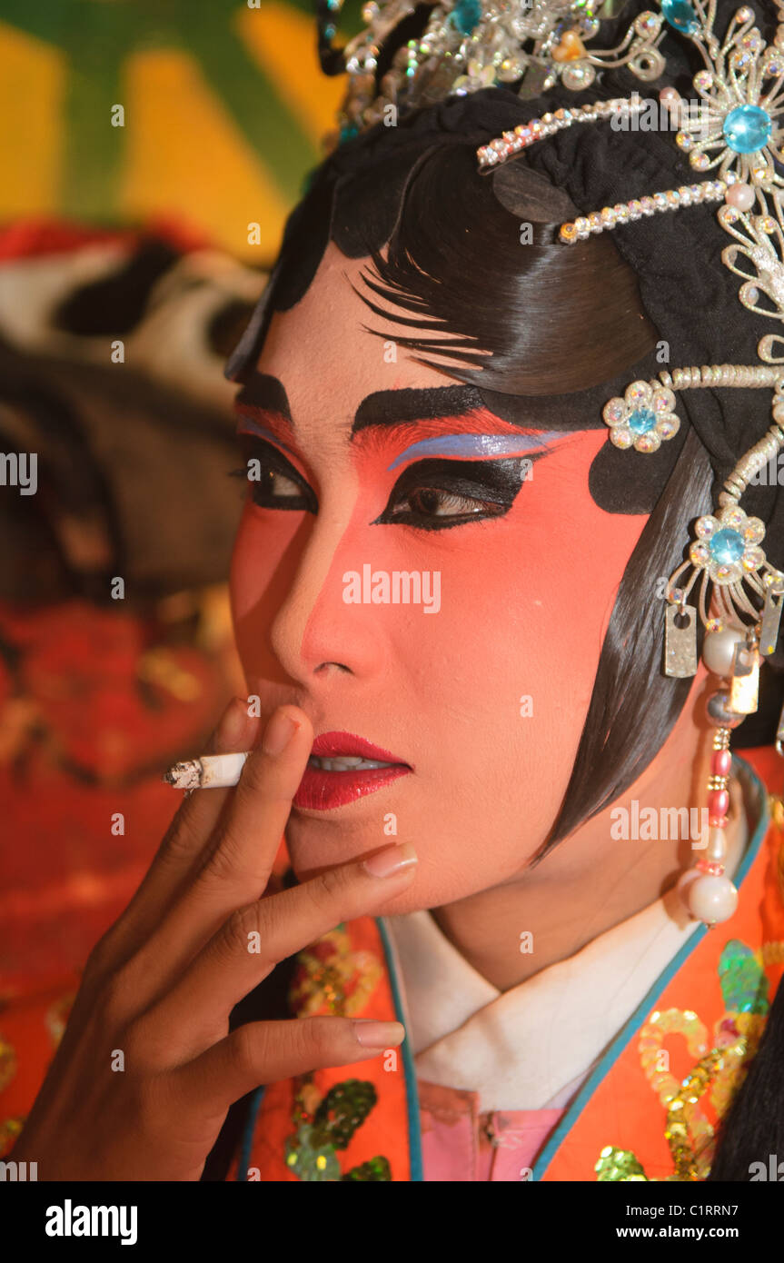 Chinese opera performer smoking backstage in Bangkok, Thailand Stock ...