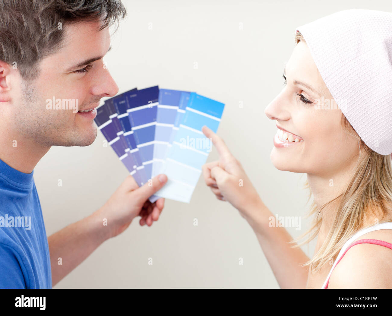 Charming couple choosing color for a room Stock Photo - Alamy