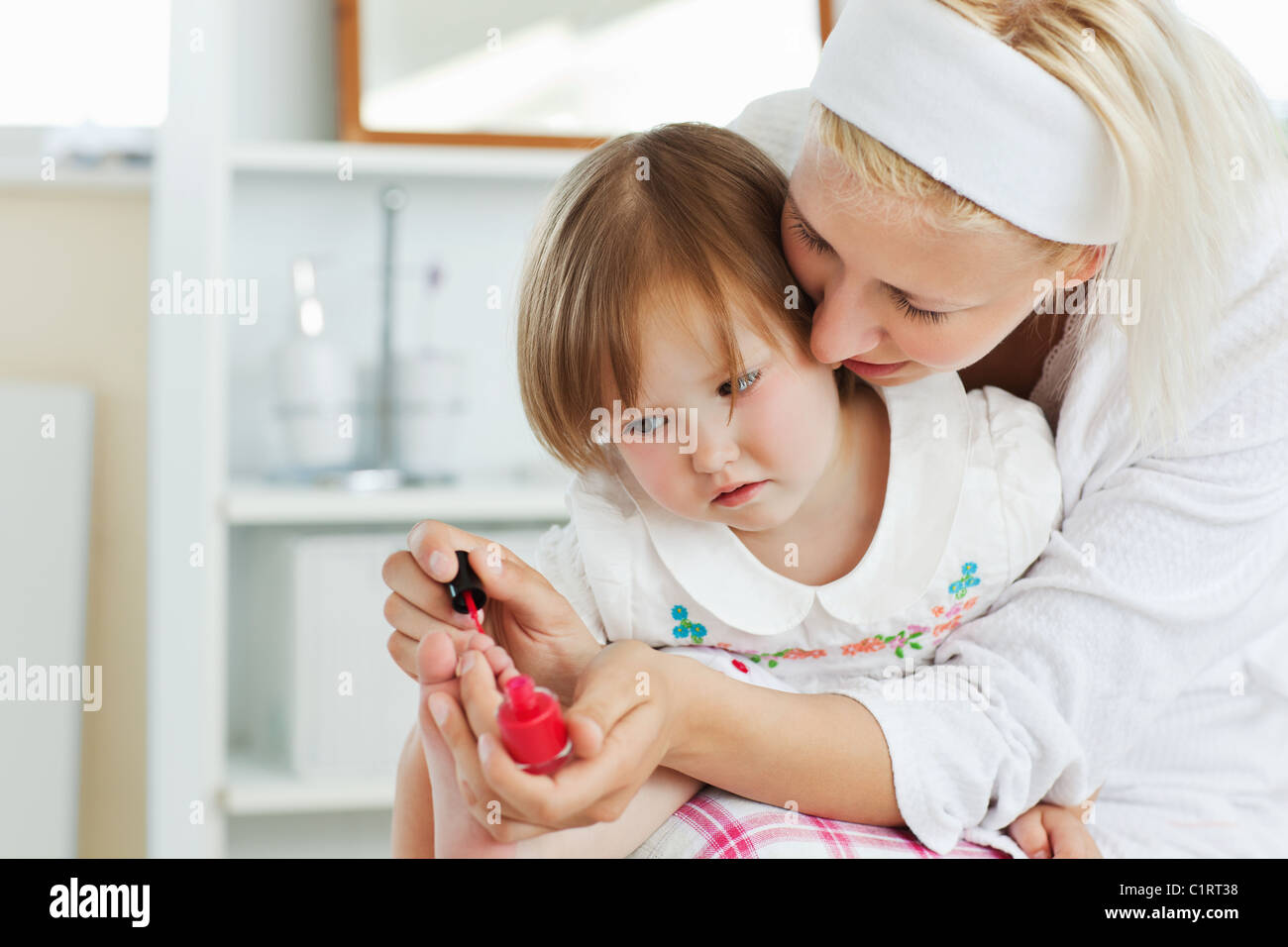 Mother taking care of her girl Stock Photo - Alamy