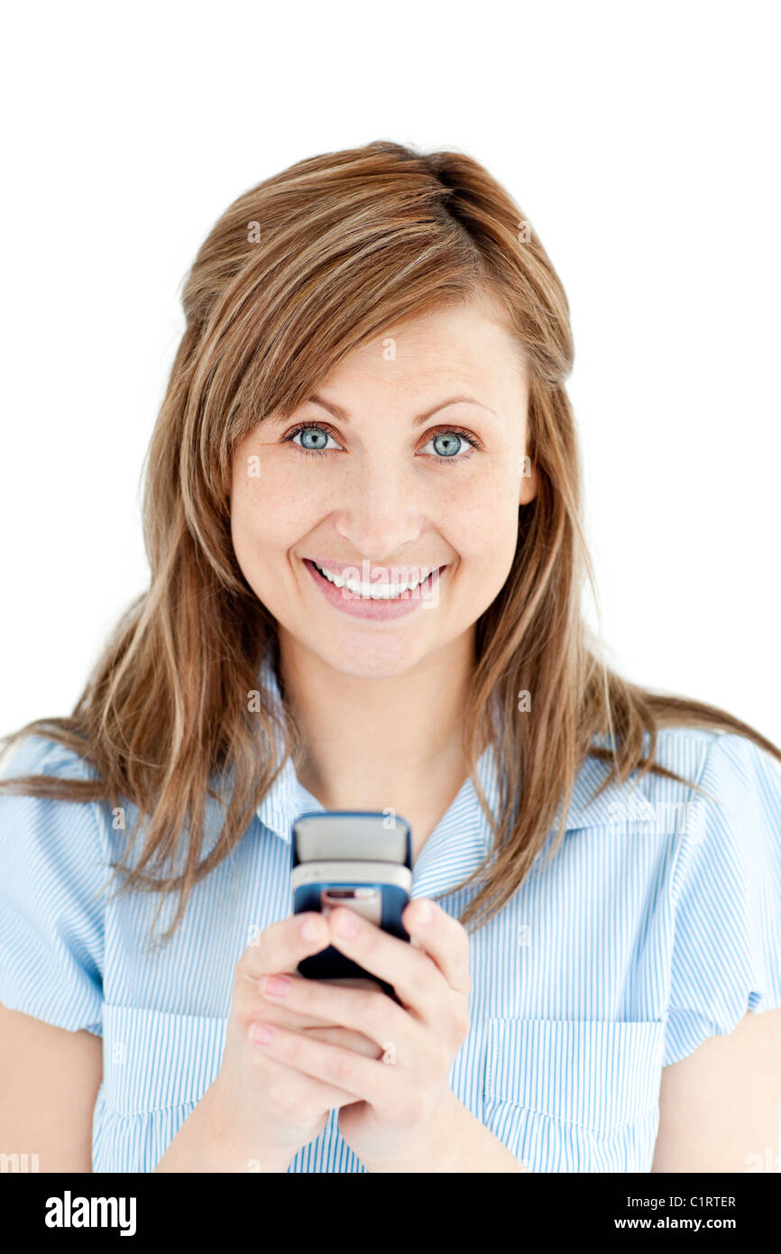 Positive businesswoman texting smiling at the camera Stock Photo - Alamy