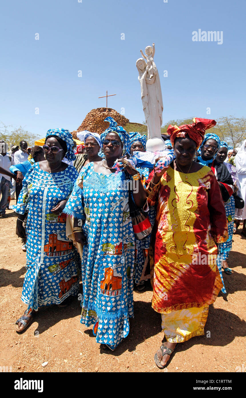 Statue of Mother Mary carried by catholic woman during Mont Rolland ...