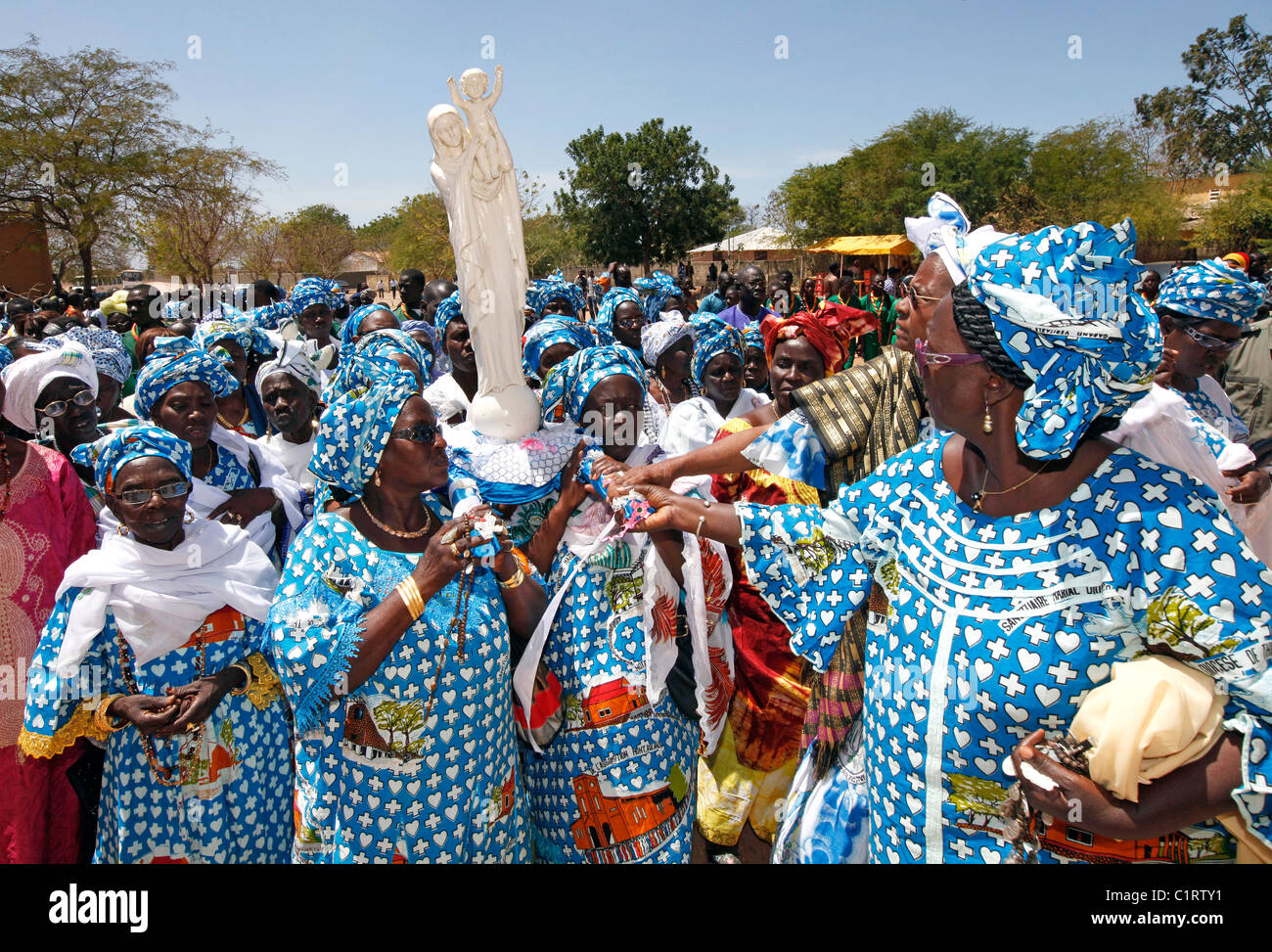 Statue of Mother Mary carried by catholic woman during Mont Rolland ...