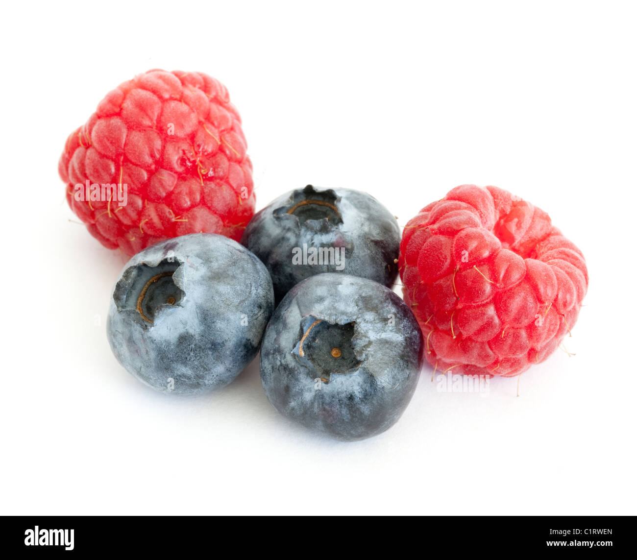 Blueberry and raspberry on the white background Stock Photo - Alamy
