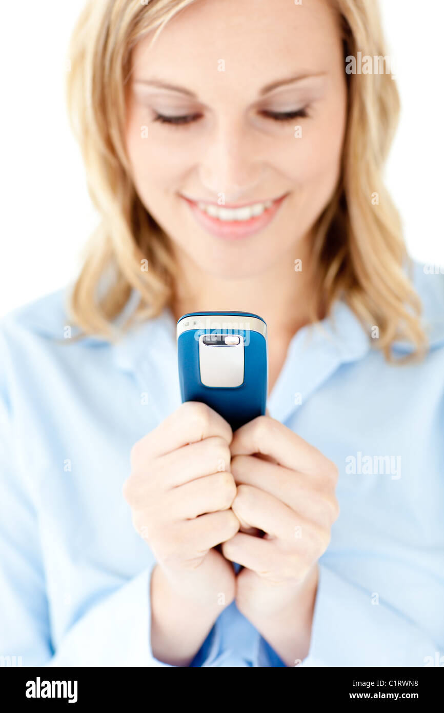 Radiant young woman writing a message on her cellphone Stock Photo - Alamy