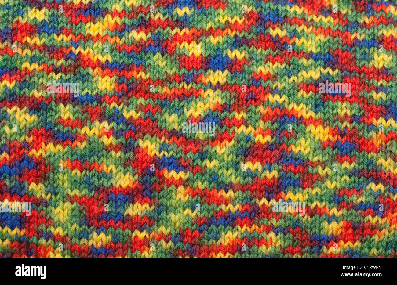 Varicoloured knitted manually from woolly threads background Stock ...
