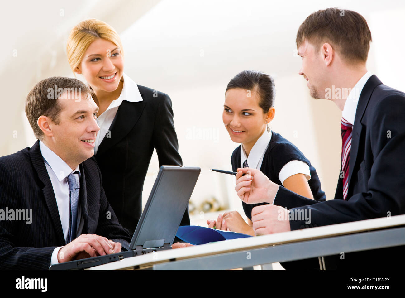 Portrait of interacting businessteam thinking about new project at ...