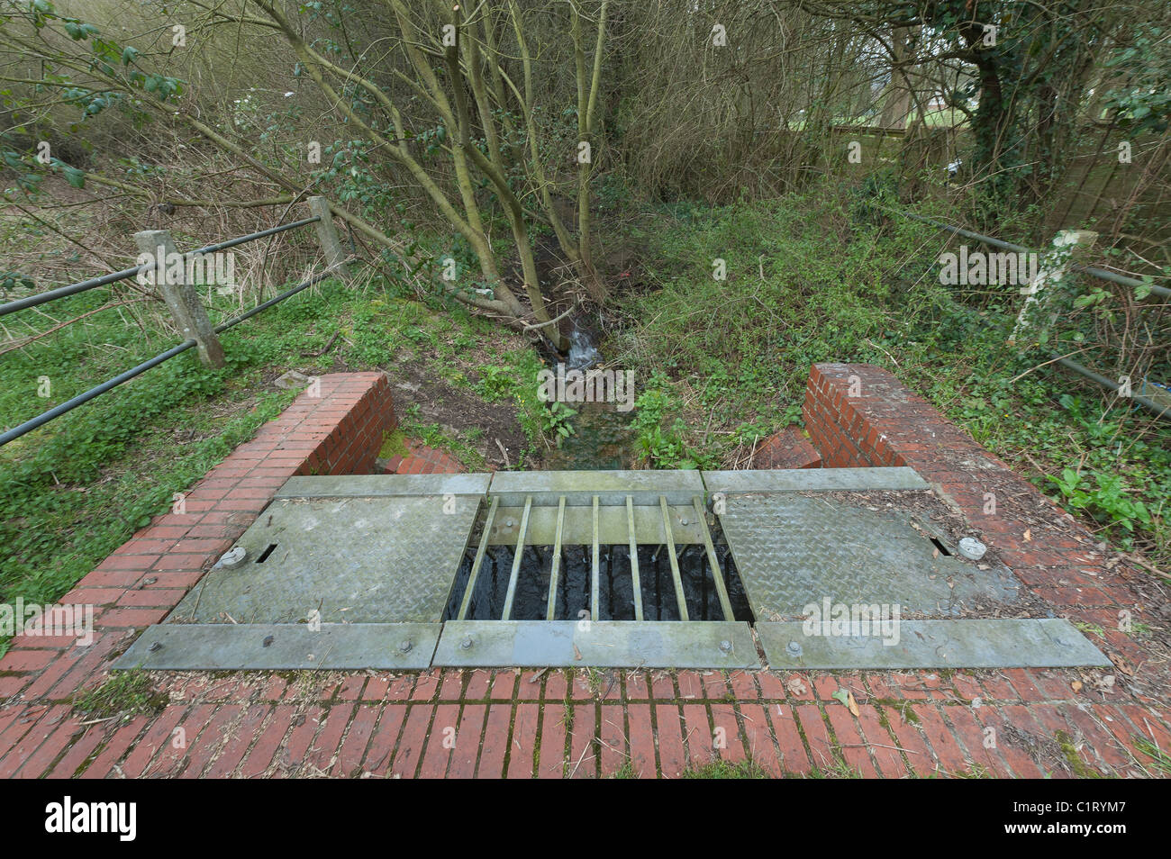 storm grate protection under M25 Stock Photo - Alamy