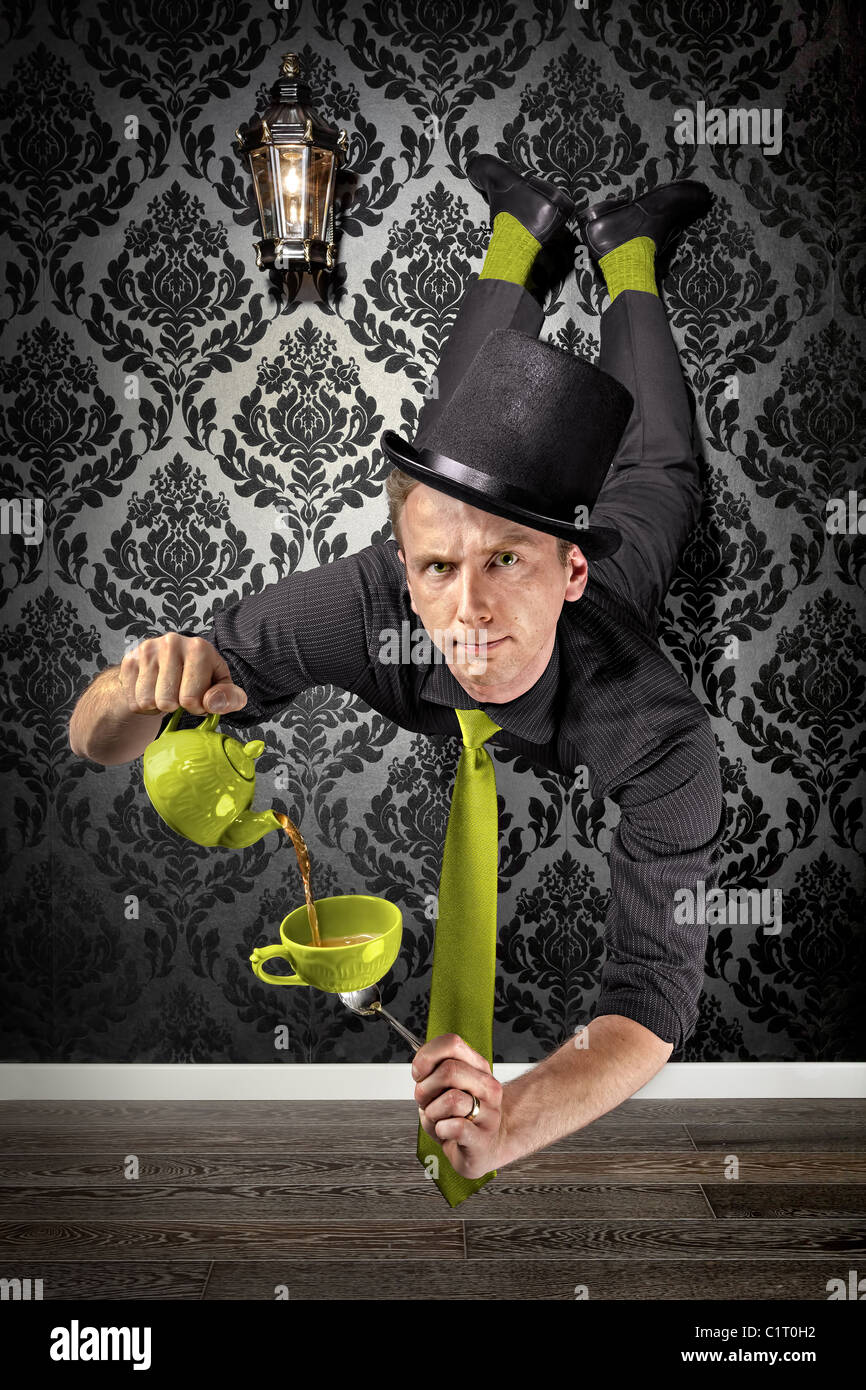 A levitating magician is pouring tea in a cup balanced on a spoon Stock ...