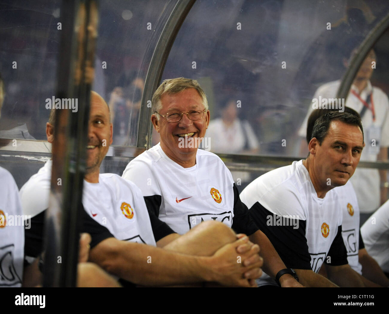 Sir Alex Ferguson of Manchester United looking happy on the bench ...