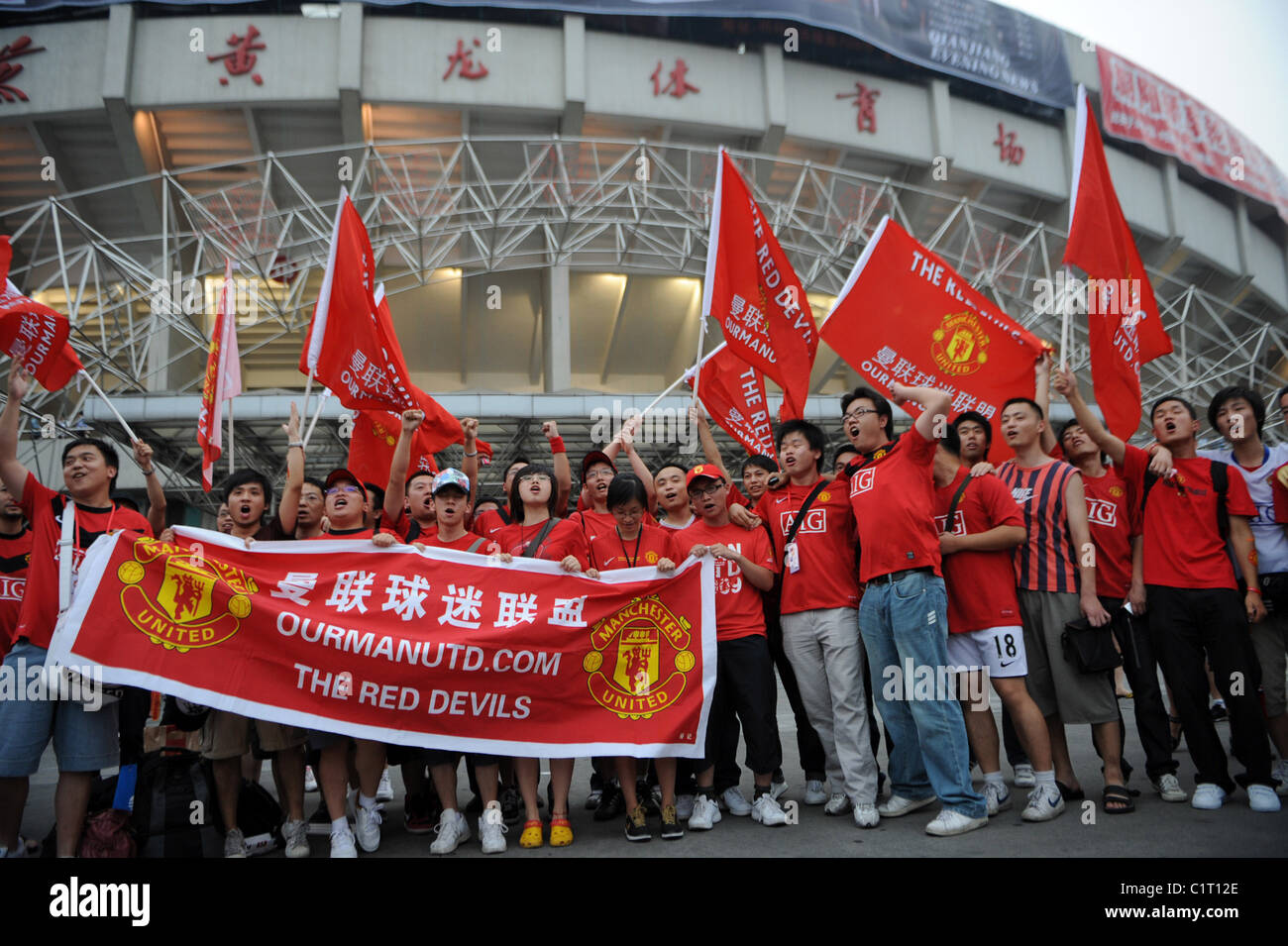 Chinese supporters of Manchester United gather outside the stadium ...