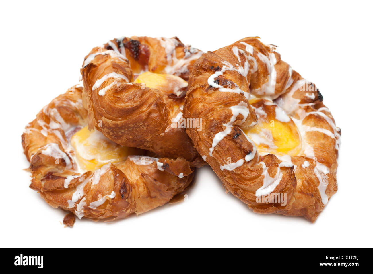 Three puff cakes with vanilla on white background Stock Photo - Alamy