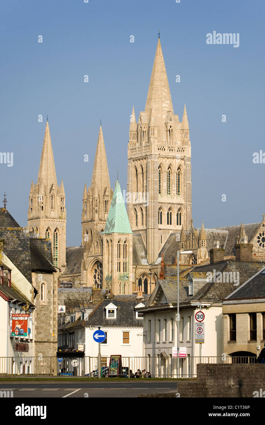 The three spires of Truro cathedral tower above buildings in the ...