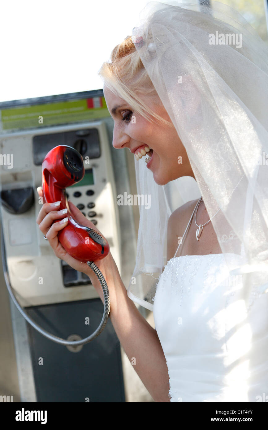 bride making a call in phone booth Stock Photo - Alamy