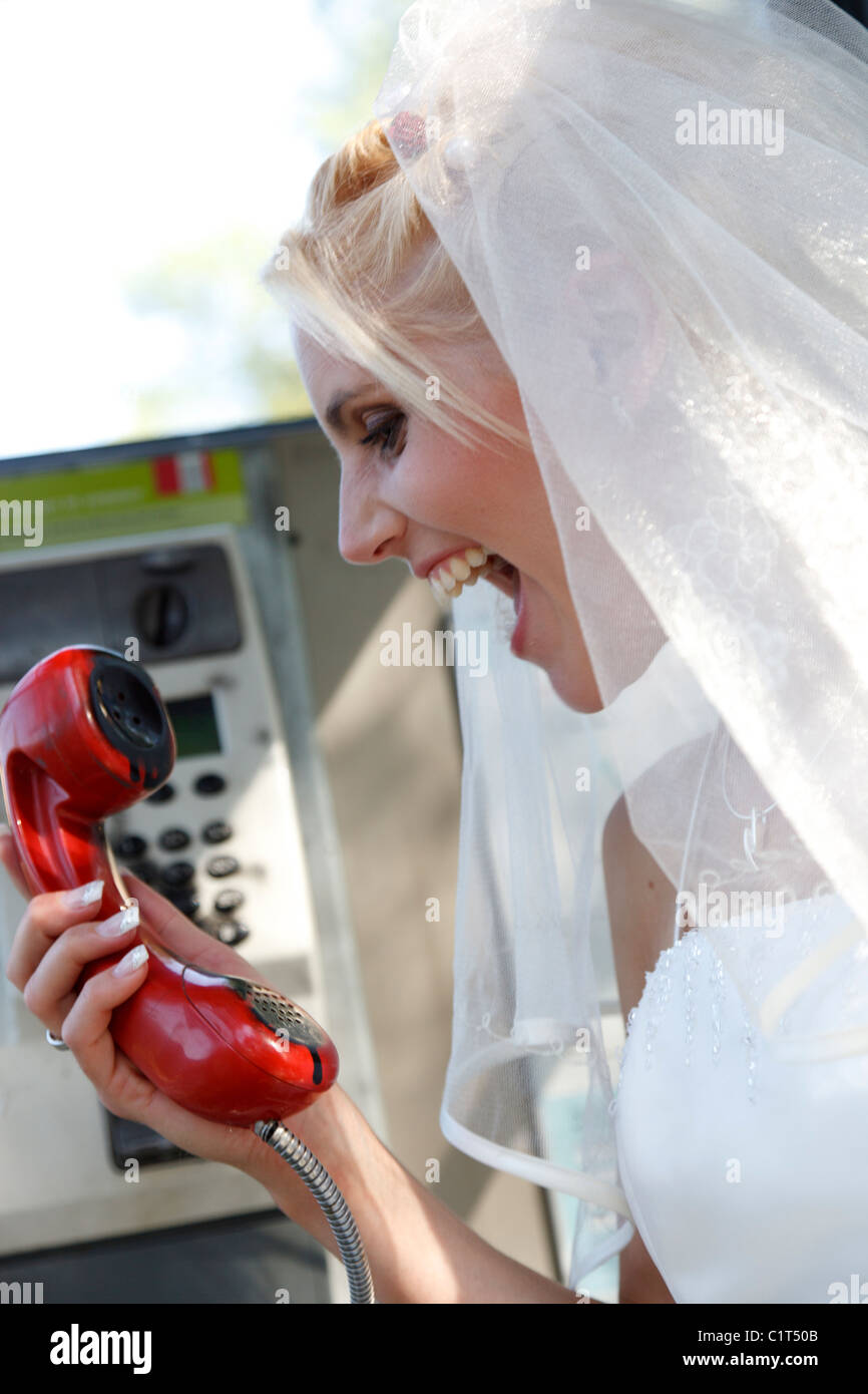 bride making a call in phone booth Stock Photo - Alamy