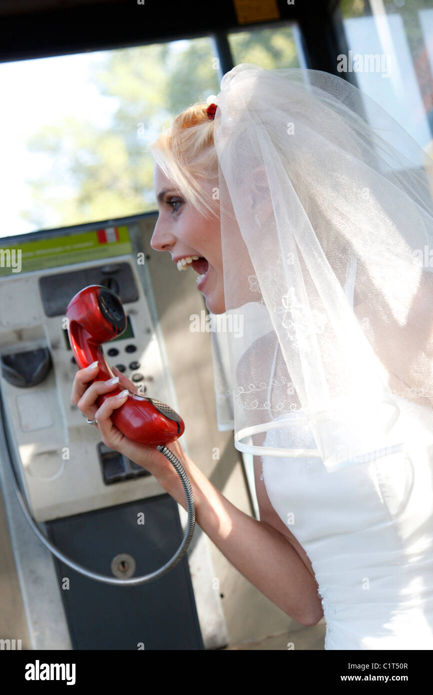 bride making a call in phone booth Stock Photo - Alamy