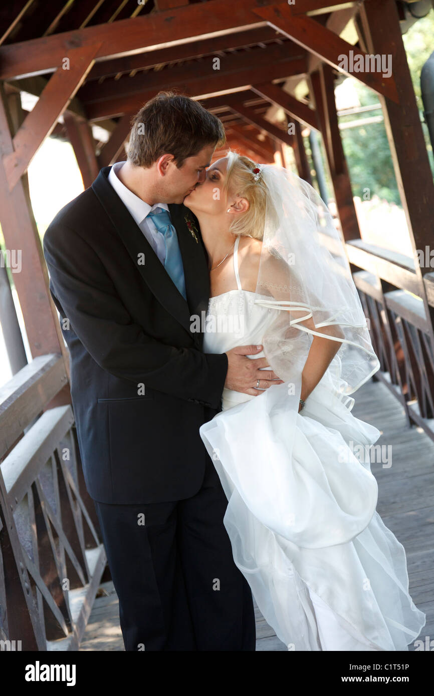 bridal couple kissing Stock Photo - Alamy