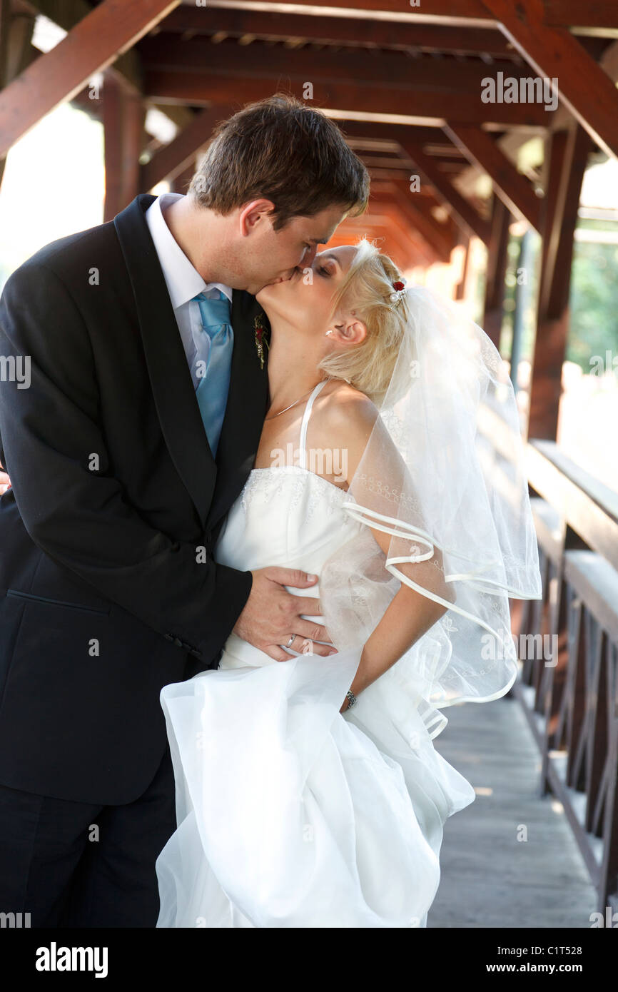 bridal couple kissing Stock Photo - Alamy