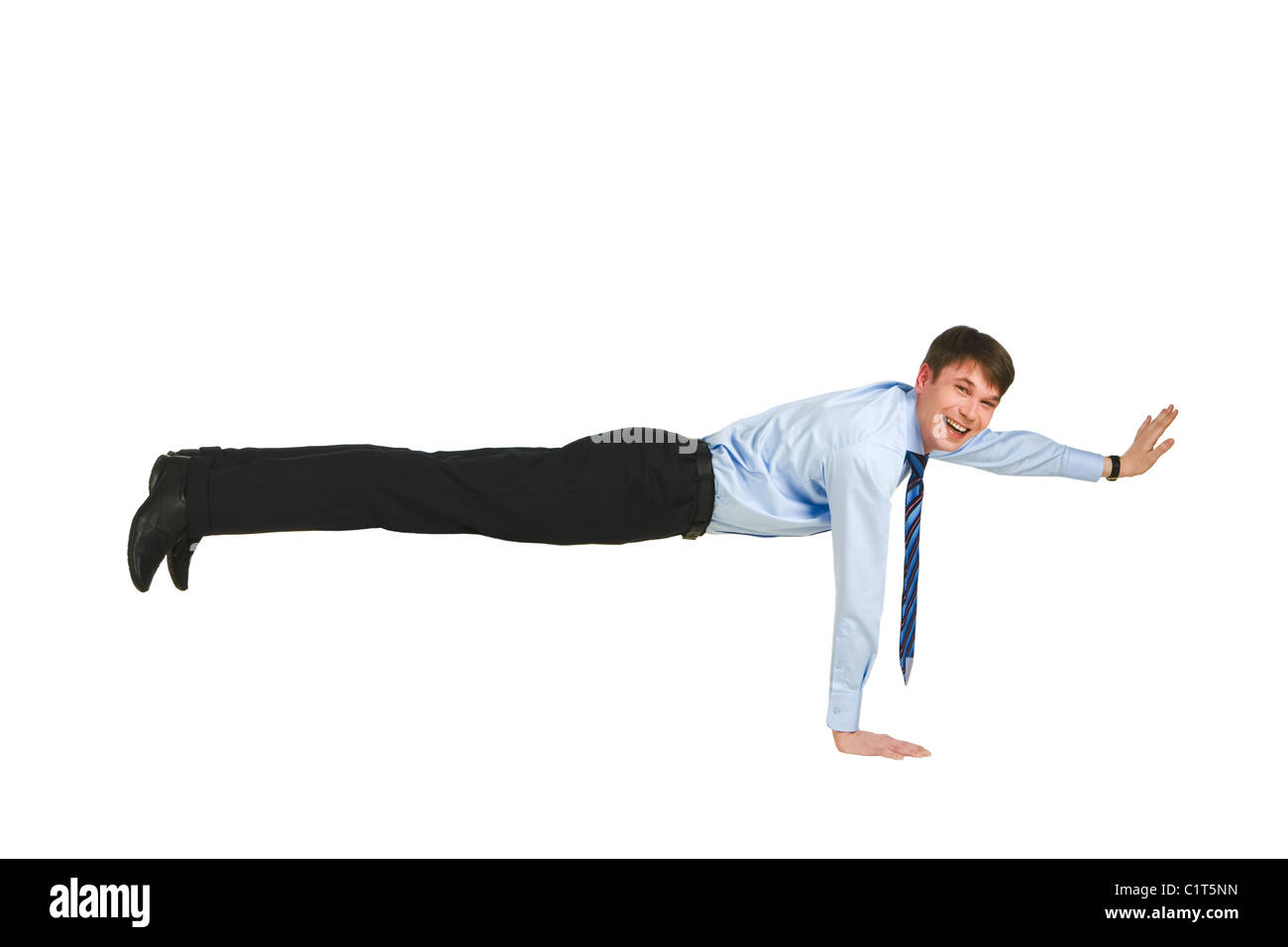 Photo of skilled man standing on one arm over white background Stock ...