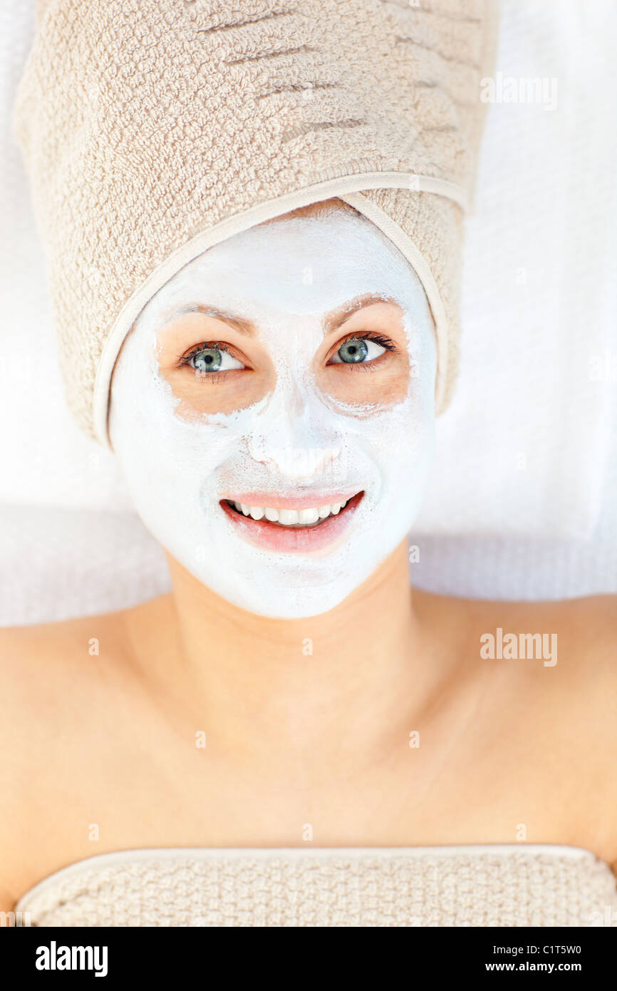 Radiant young woman having white cream on her face Stock Photo - Alamy