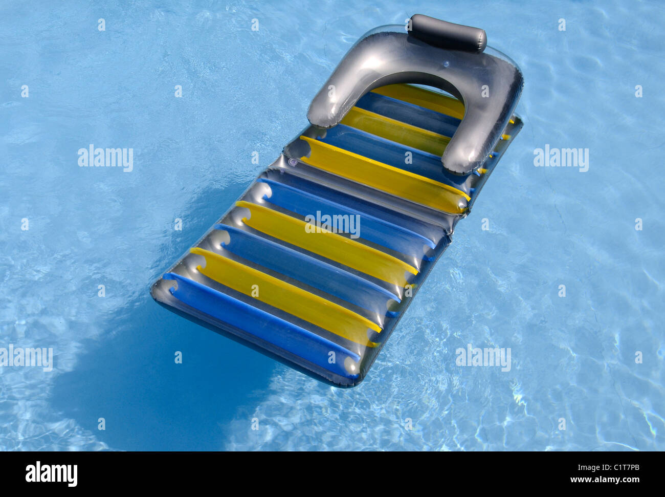 Float in swimming pool Stock Photo - Alamy