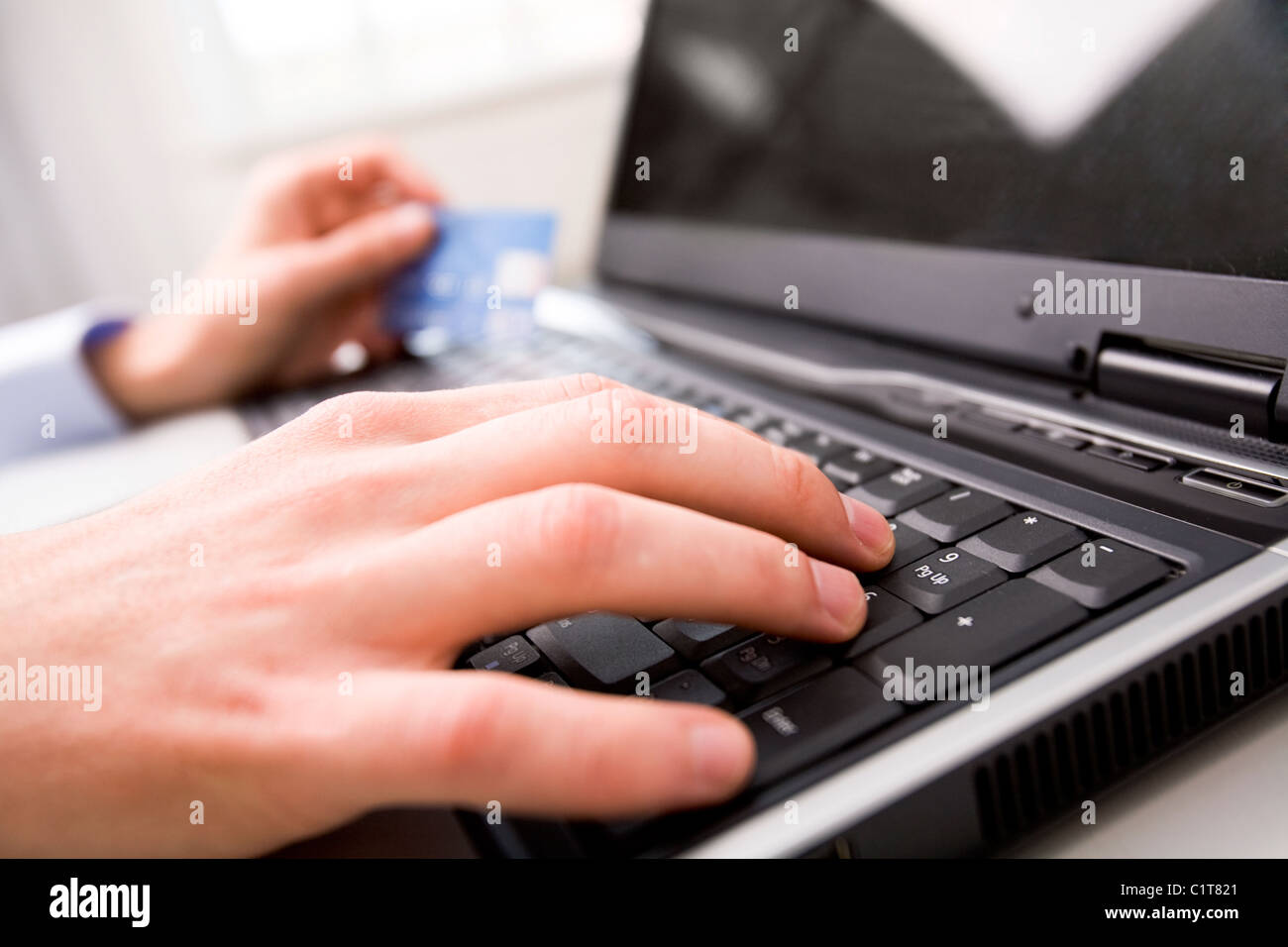 Close-up of male hand over black keyboard of laptop during typing Stock ...
