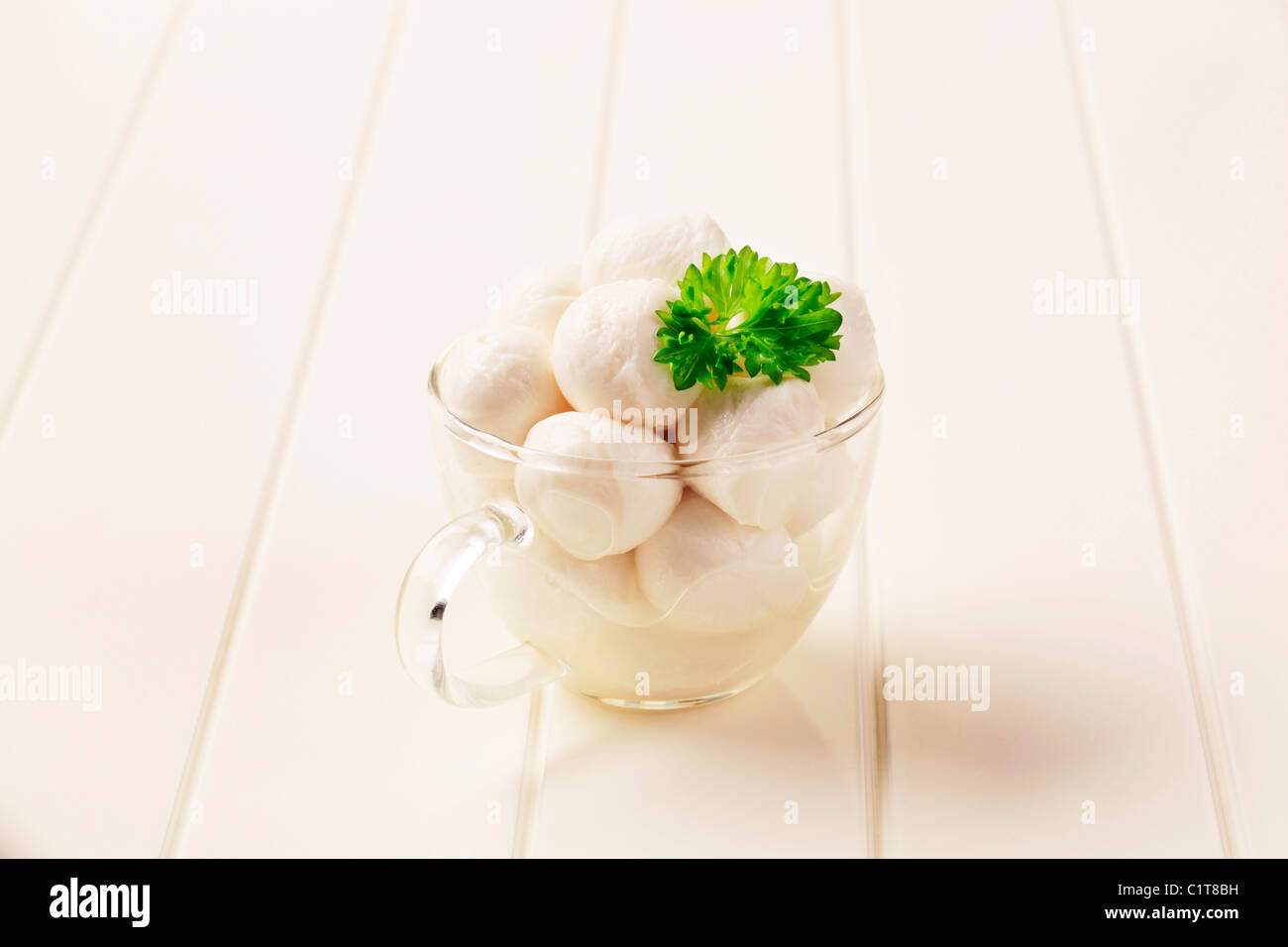 Baby mozzarella cheese in a glass cup Stock Photo - Alamy