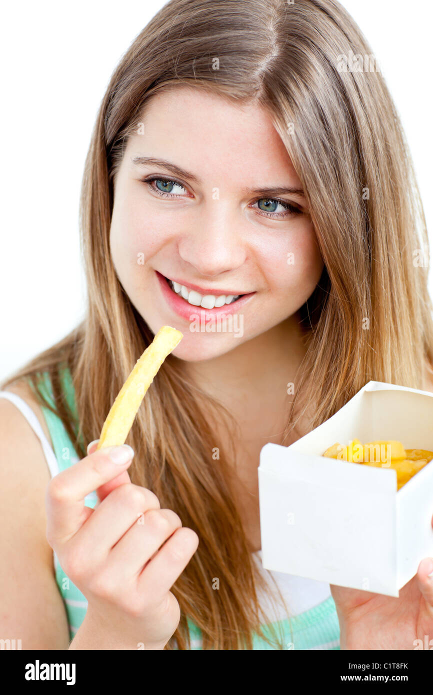 Radiant young woman eating fries Stock Photo - Alamy