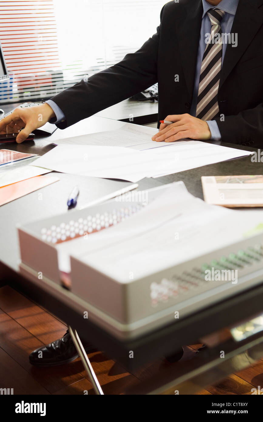 Executive working in office, cropped Stock Photo - Alamy