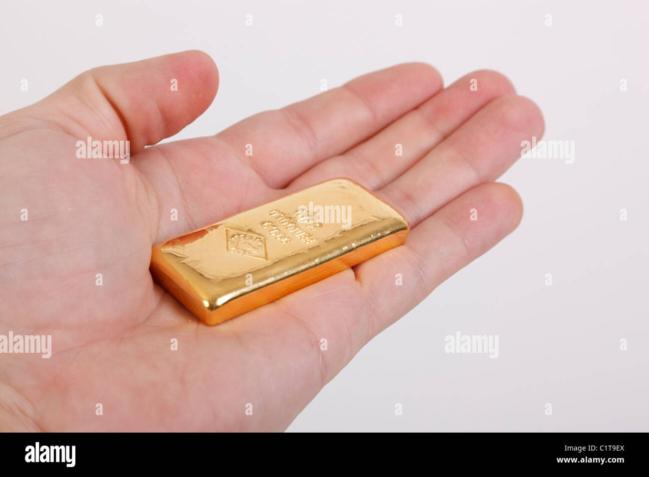 gold bar in hand Stock Photo - Alamy