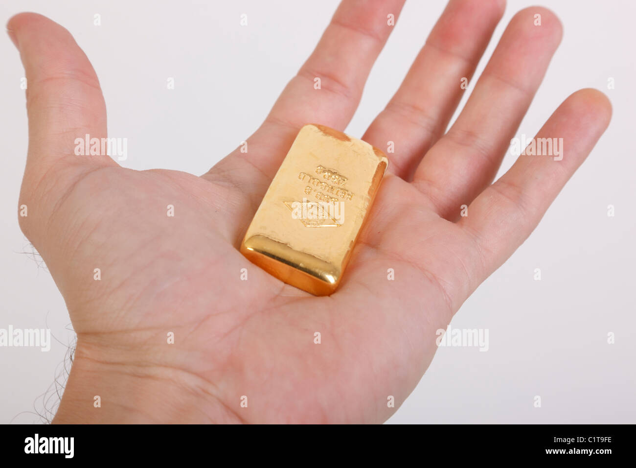 gold bar in hand Stock Photo - Alamy