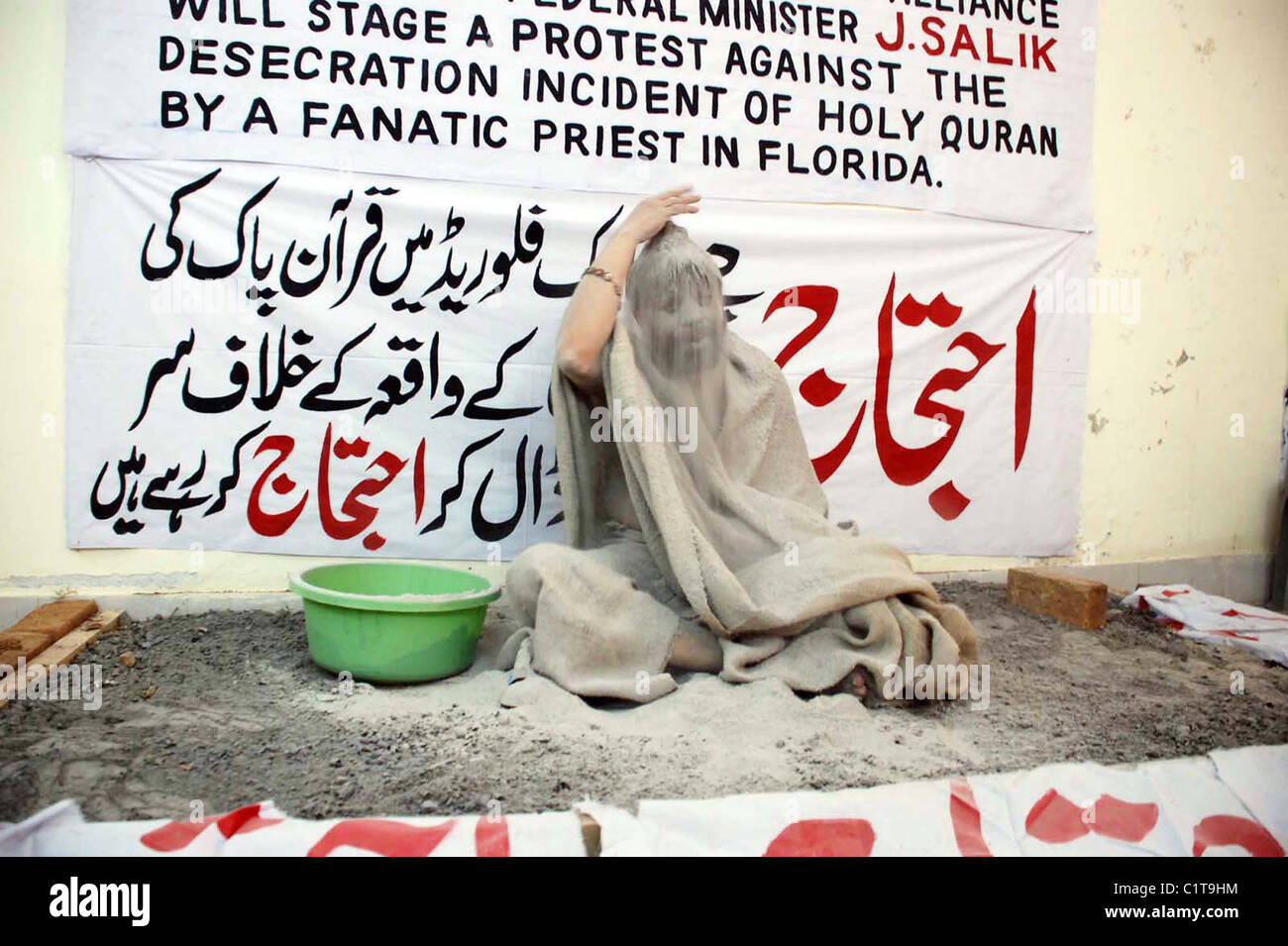 Renowned Social Activist J.Salik puts sand over his head as he is ...
