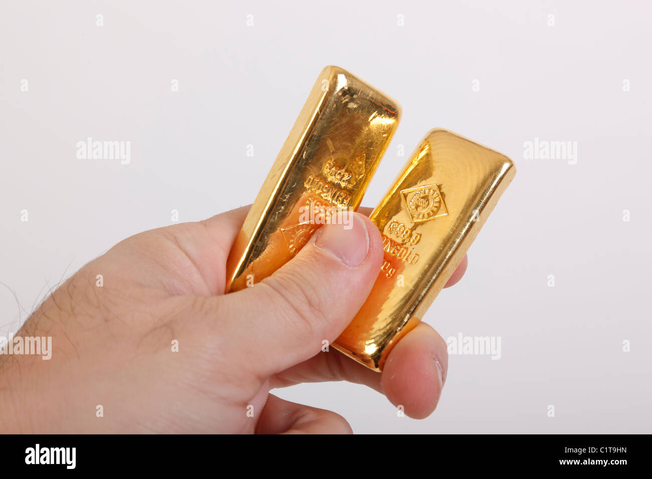 Gold bars in hand hi-res stock photography and images - Alamy