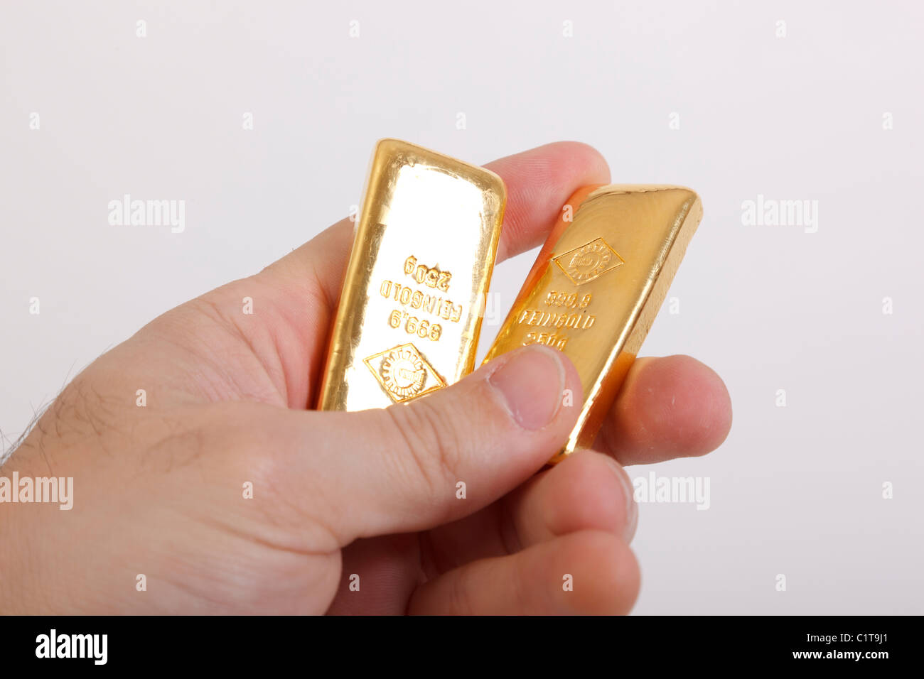 gold bars in hand Stock Photo - Alamy