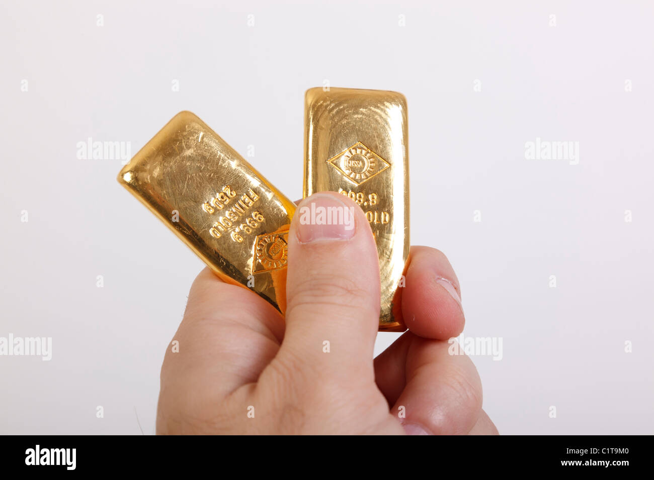 Gold bars in hand hi-res stock photography and images - Alamy