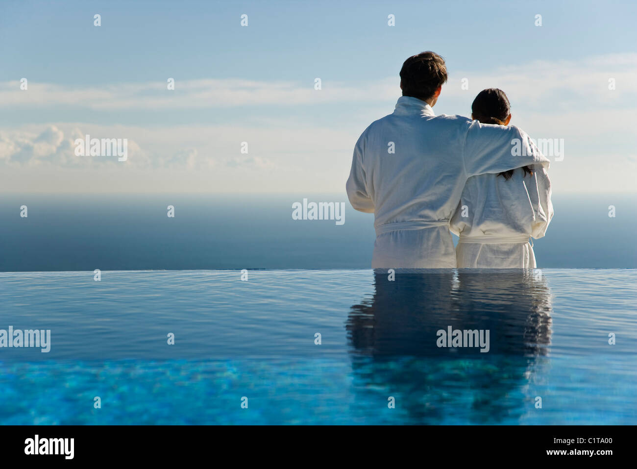 Couples at edge of swimming pool hi-res stock photography and images ...