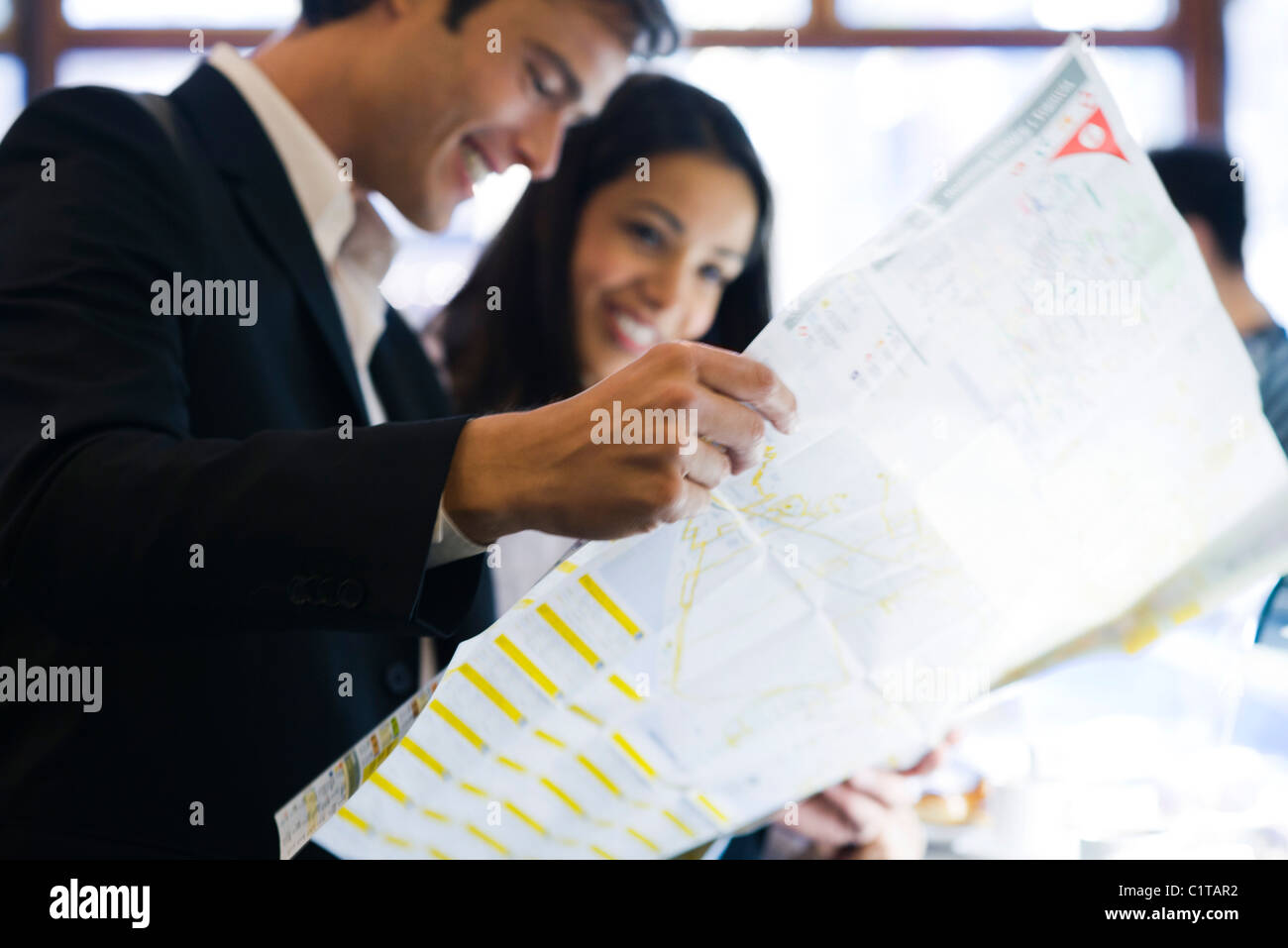 Couple looking at map together Stock Photo - Alamy