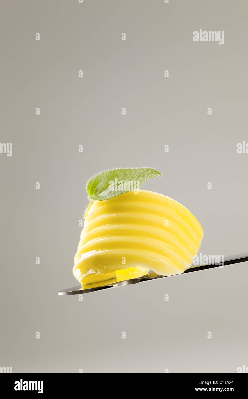 Closeup of a butter curl on a knife Stock Photo - Alamy