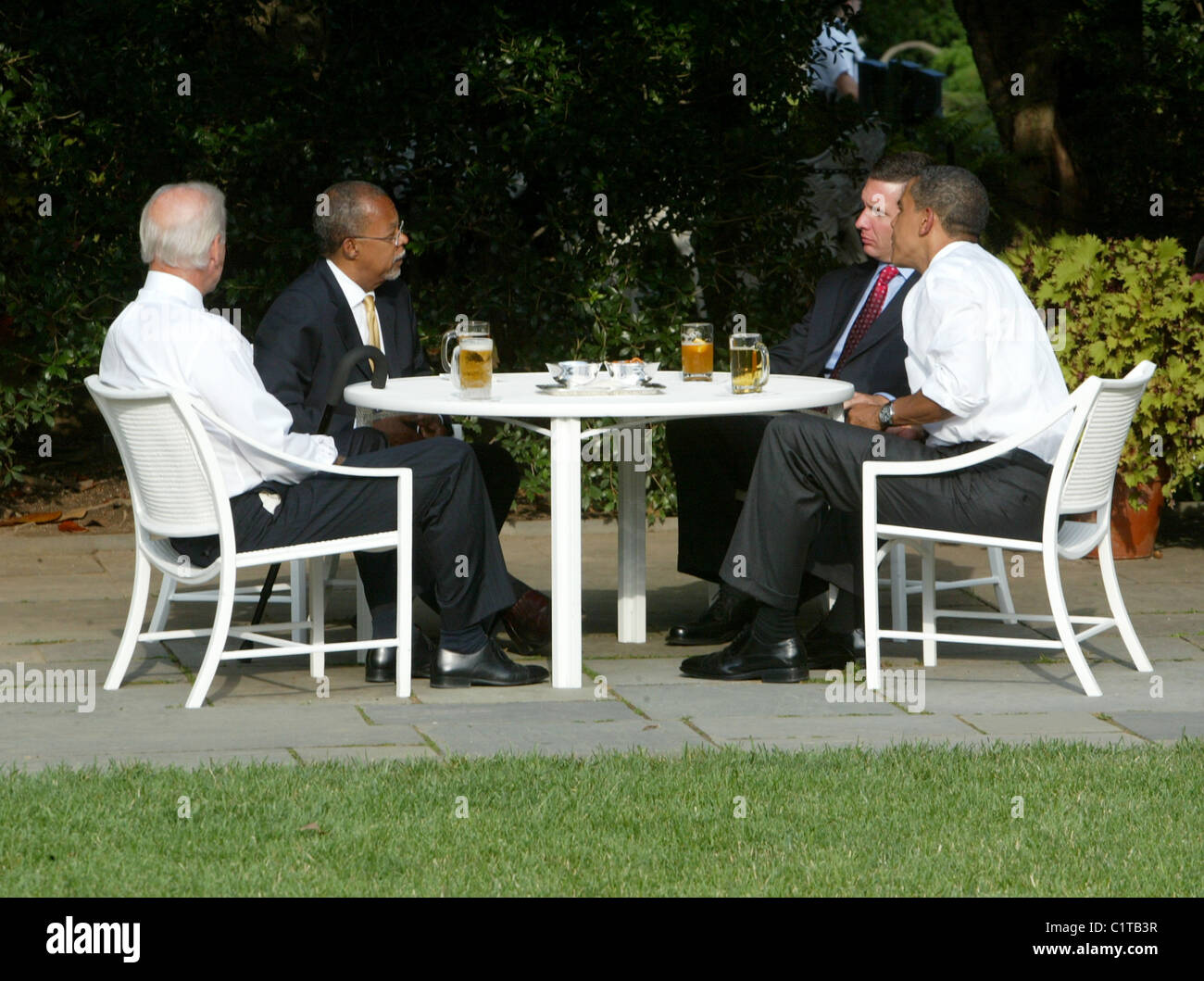 President Barack Obama sits with Police Sergeant James Crowley (2nd ...