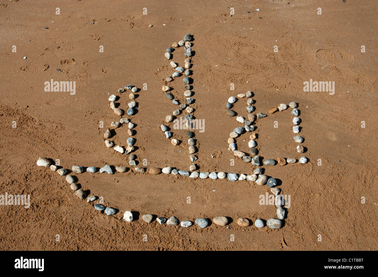 Beach in Stone writing beach sea sand seaside sailing ship Stock Photo ...