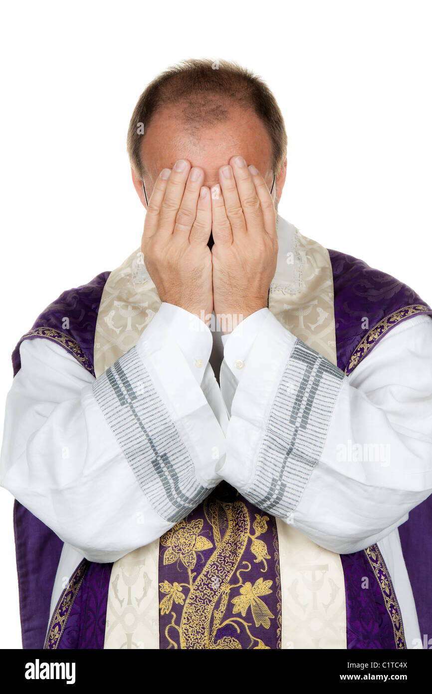 Catholic priest in despair Stock Photo - Alamy