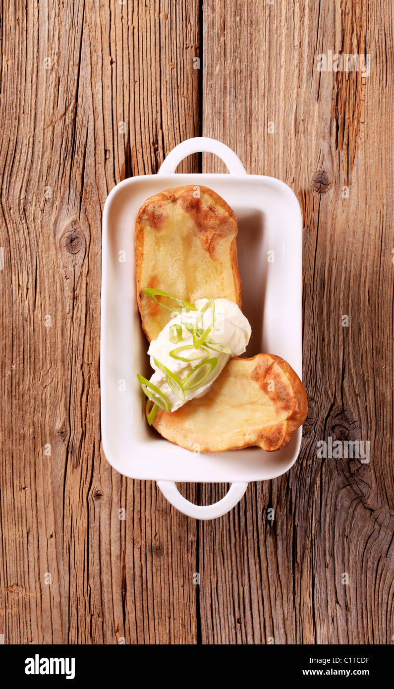 Baked potato and cream cheese sprinkled with spring onion Stock Photo ...