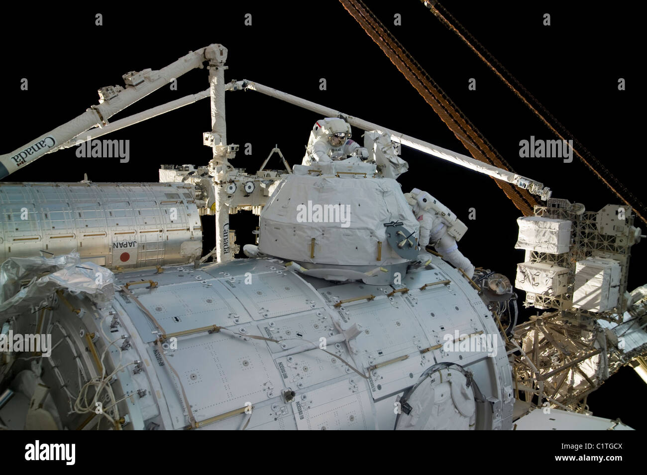 Astronauts participate in a session of extravehicular activity Stock ...