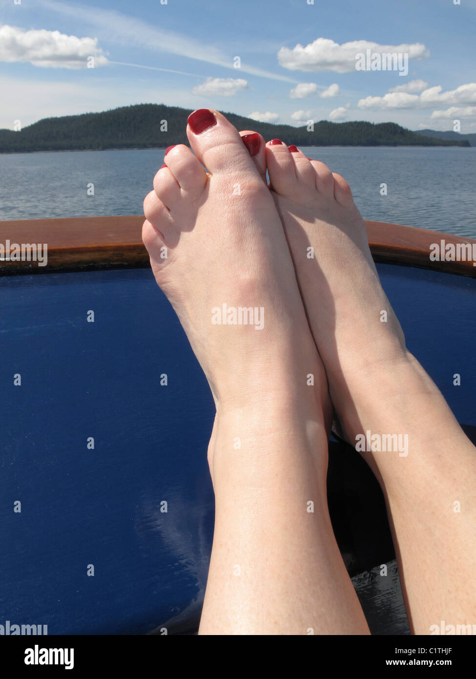 Woman's legs on the boat, Alaska, USA Stock Photo - Alamy