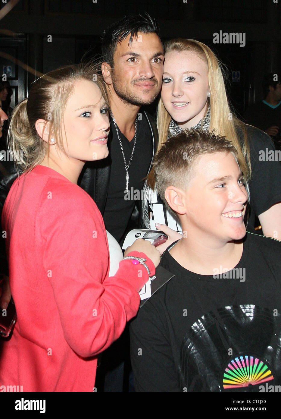 Peter Andre poses with fans after leaving BBC Radio One studios. London ...