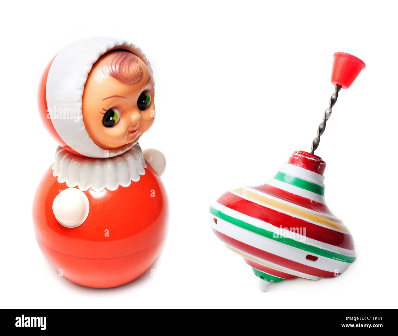 Collage aging doll and toy whirligig on white background Stock Photo ...