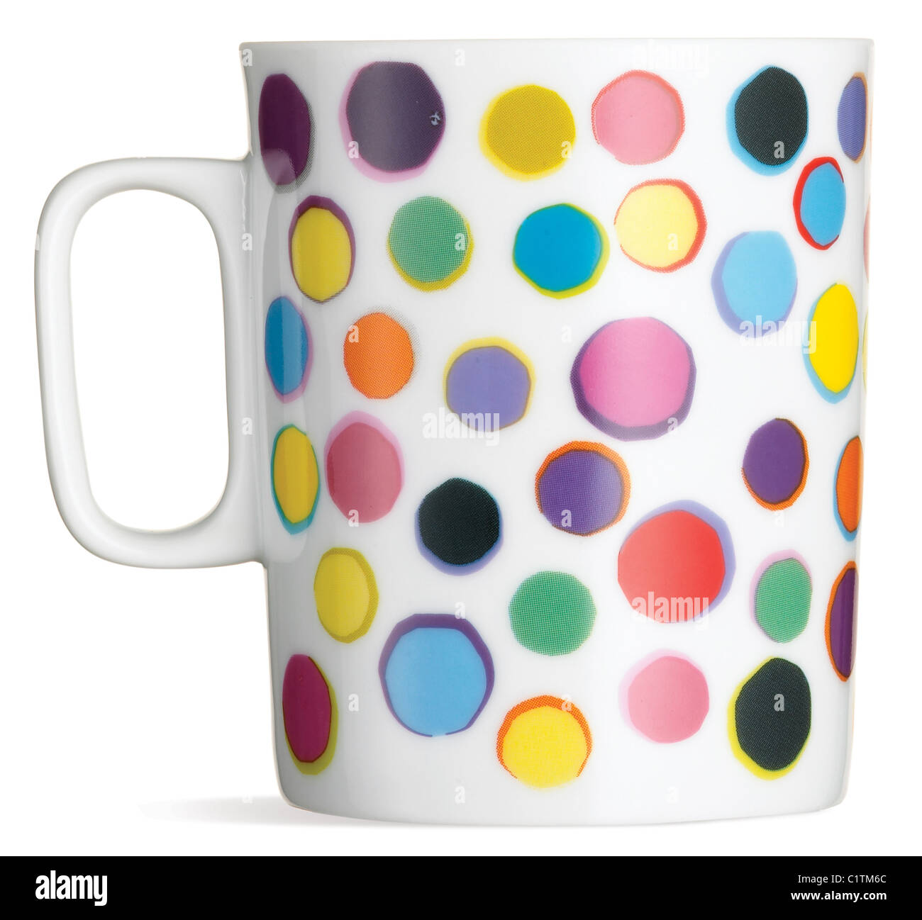a side view of a spotty tea coffee mug isolated on a white background ...
