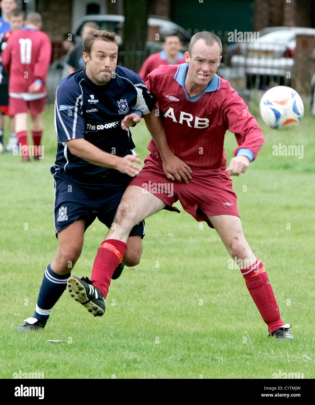 Jamie Lomas of Hollyoaks (left), playing at a charity football match ...