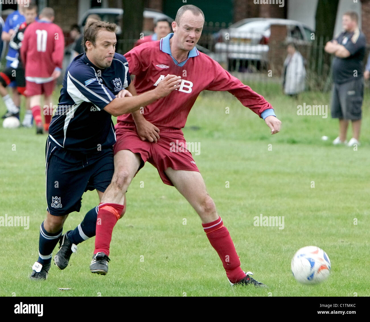 Jamie Lomas of Hollyoaks (left), playing at a charity football match ...