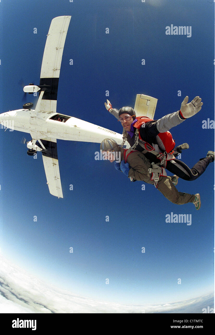 Two people skydiving (fish-eye lens Stock Photo - Alamy