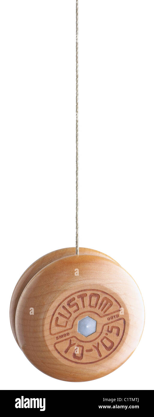 a wooden yo-yo childs toy with string isolated on a white background ...